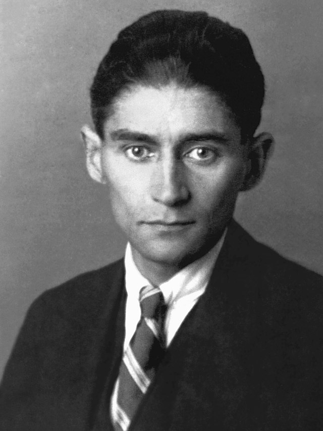 Franz Kafka poses for a portrait, c. 1923 – Wikimedia Commons – The Index