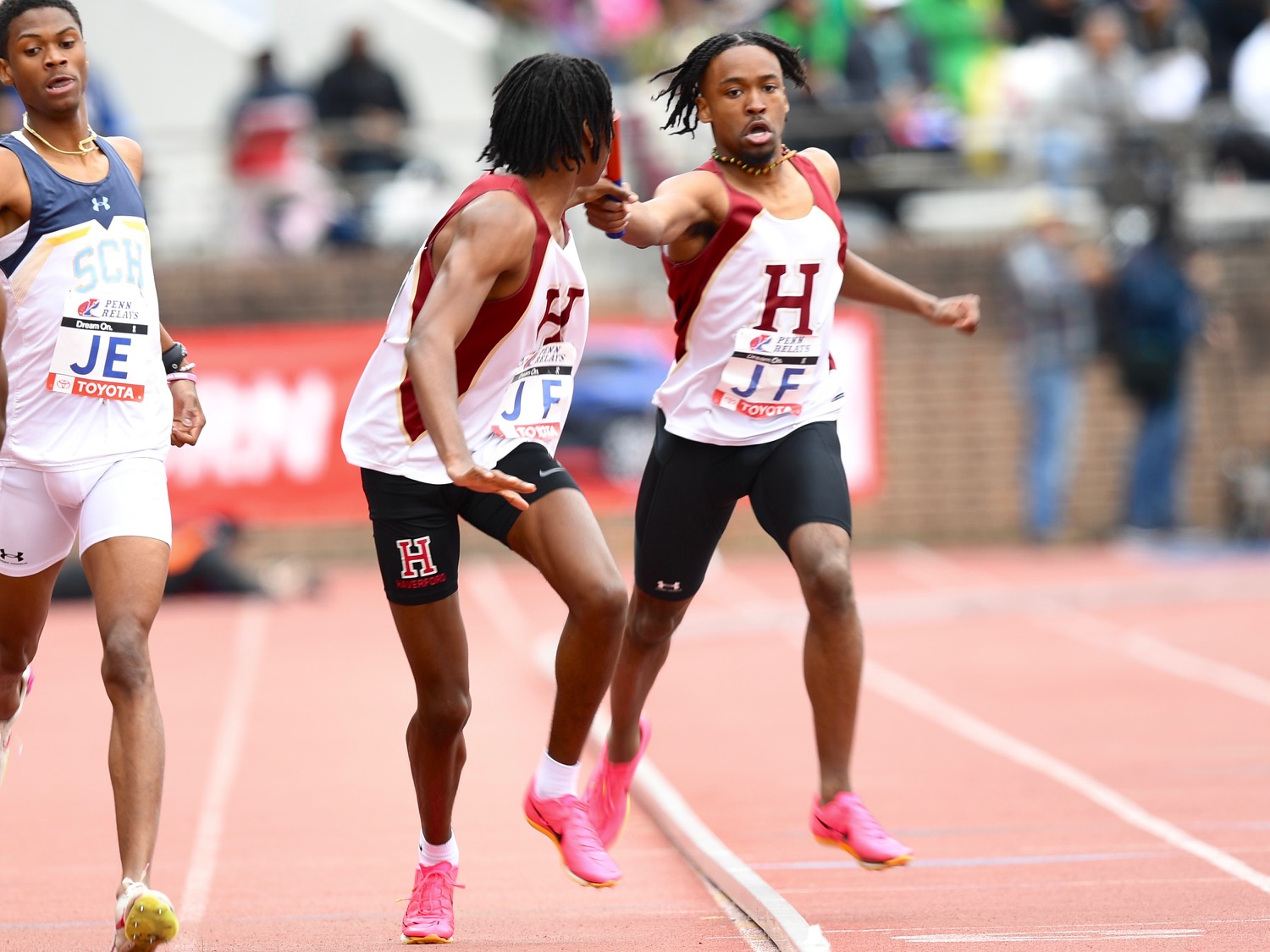 Track – Keegan Jacobs _24 receives the baton from Andre Inniss _24 at the Franklin Relays – Dr ...